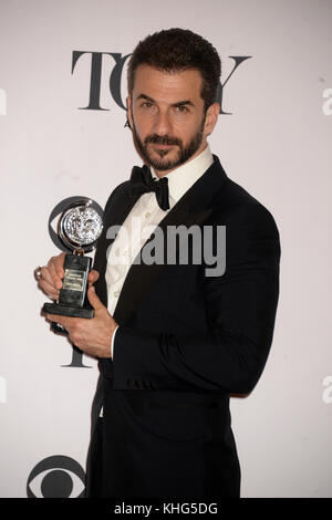 Michael Aronov poses in the press room with the award for best ...
