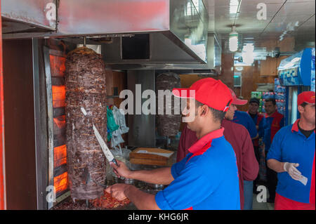 Man Slicing Meat at Shawarma Reem take-away restaurant, Amman, Jordan ...