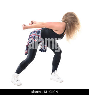 Bent female jazz dancer moving and raising up with hair tousled over ...