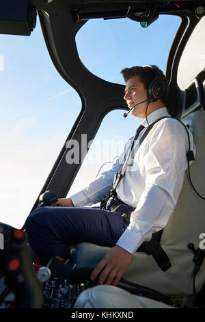 pilot in cockpit of helicopter during flight Stock Photo - Alamy