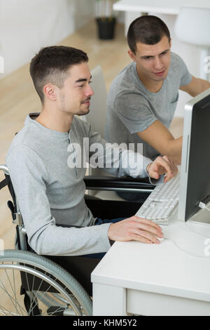 Disabled teen boy doing homework in his wheelchair. Full body isolated ...