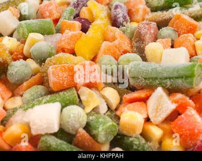 Mixed Frozen various vegetables in plastic bags with ice, top view ...
