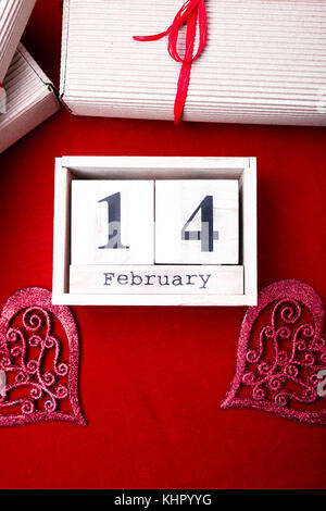 Wooden calendar show of February 14 with red heart Stock Photo - Alamy