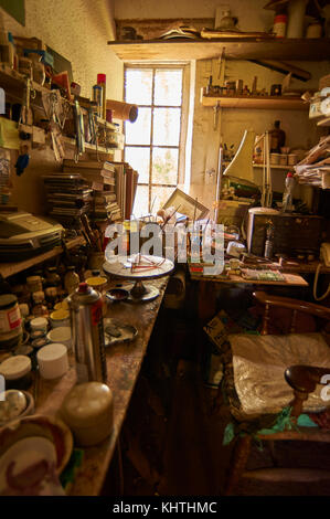 Cluttered work bench in the pottery shop Stock Photo - Alamy