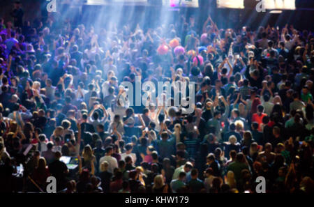crowd having fun at concert - blurred image Stock Photo - Alamy