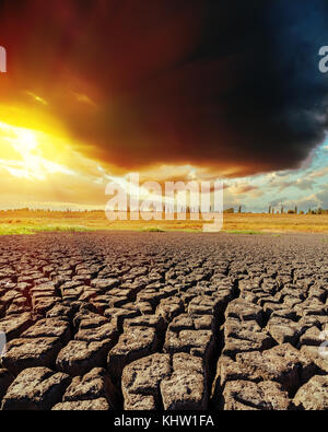 drought land closeup and low clouds in blue sky Stock Photo - Alamy