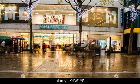 Croydon high street shops with Christmas lights ON showing the Whitgift ...