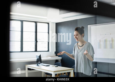 Lecturer delivering lesson in class Stock Photo - Alamy