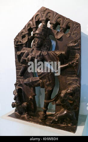 Stone statue depicting Mahishasura, a combination of both an Asura and ...