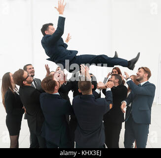 large business team rocking their leader Stock Photo - Alamy