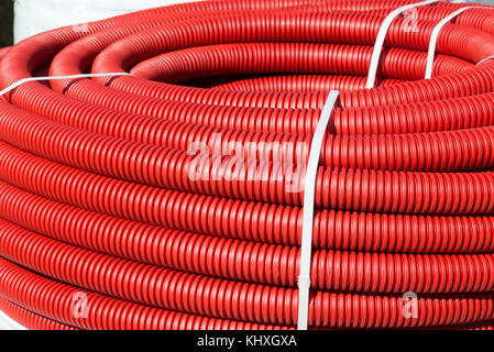 roll of red Flexible Plastic Pipes Stock Photo - Alamy