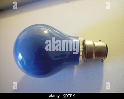 A blue light globe with a bayonet fitting, commonly used in household ...