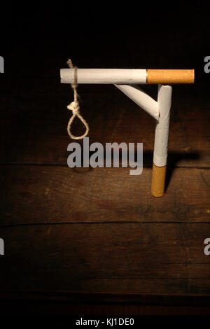 Cigarettes on dark wooden background Stock Photo - Alamy