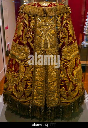 A Dutch Torah mantle which covers the Torah Scroll, which sits within ...