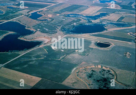 An aerial view of prairie potholes in a wetland, showcasing the unique ...