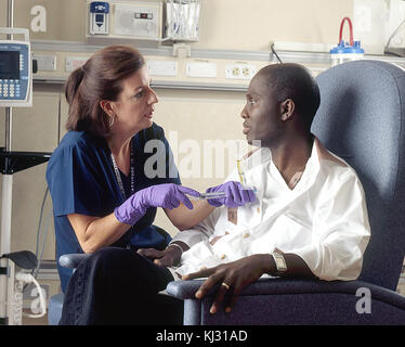 Nurse administers chemotherapy (2 Stock Photo - Alamy