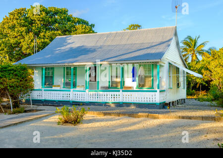 Caribbean-style house with a corrugated tin roof and a veranda in ...