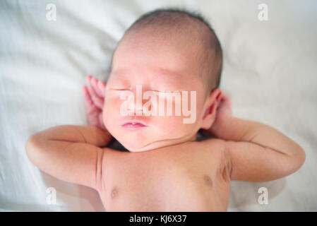 New born baby boy stretching Stock Photo - Alamy