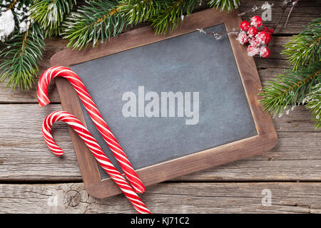 Candy canes on a green chalkboard. Christmas and holidays concept Stock ...