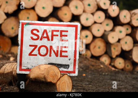 Safe Zone signage at a logging site provides guidance for workers and ...