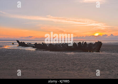 Sunset picture of the exposed wreck of the wooden Norwegian barque SS ...