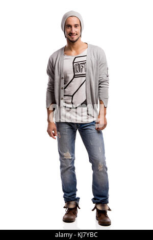 Handsome latin man standing over isolated background looking confident ...