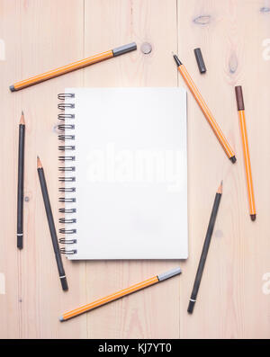 Notebook with white sheets and colored pencils for drawing on white ...