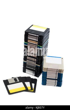 Vertical pile of computer floppy disks with usb disk isolated on a ...