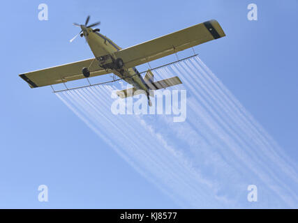 Airplane spraying pesticides Stock Photo - Alamy