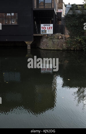 To Let sign on side of commercial building with wall mural in ...