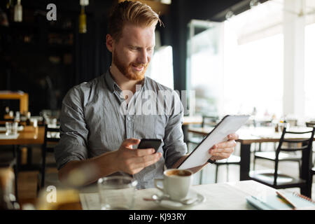 Businessman constantly working Stock Photo - Alamy
