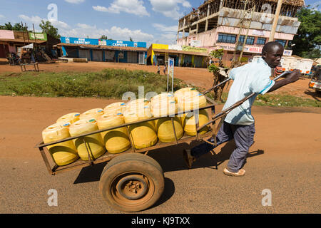 People transport containers of water in Havana, Wednesday, May 27, 2026 ...