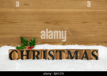 A design of "Merry Christmas" on the wooden background with decorations ...