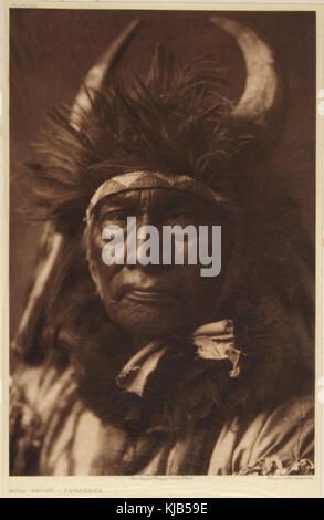 A portrait of Bull Chief, an Apsaroke (Crow) Native American man, taken ...