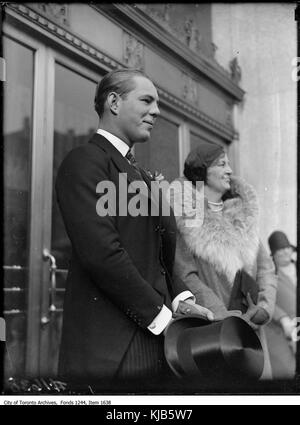 Flora McCrae Eaton and son John David Eaton exiting vehicle at opening ...