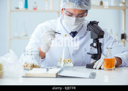 Chemist mixing perfumes in the lab Stock Photo - Alamy