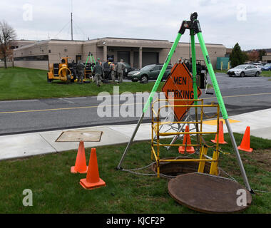 Airmen of the 211th Engineering Installation Squadron work on team ...