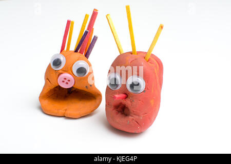 fun modelling clay figures with shocked expression on isolated white ...