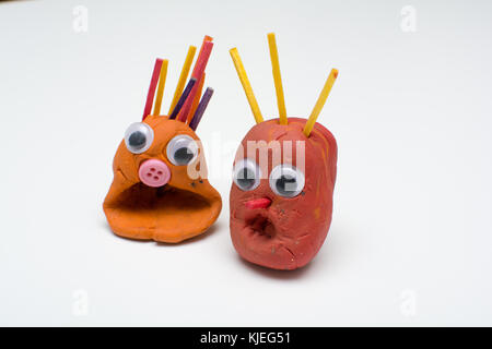fun modelling clay figures with shocked expression on isolated white ...