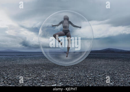 Sphere floating in remote landscape Stock Photo - Alamy