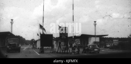 Blurred and damaged photo of military vehicles, cars and a highway ...