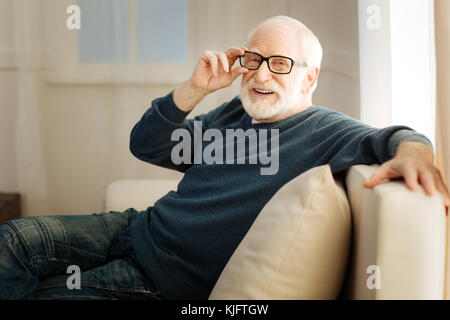 Positive delighted male person keeping smile on his face Stock Photo ...