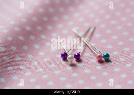 Fixing pins on cloth Stock Photo - Alamy