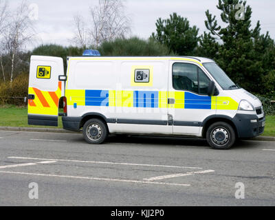 Police speed camera van parked on a bridge over a dual carriageway in ...