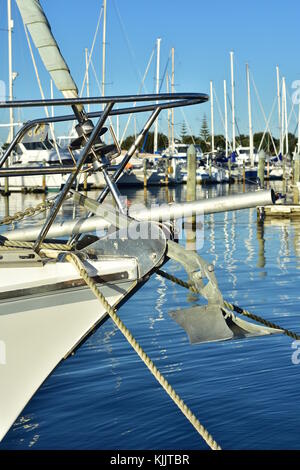 Sailboat bow with stainless steel railing and marine equipment in ...