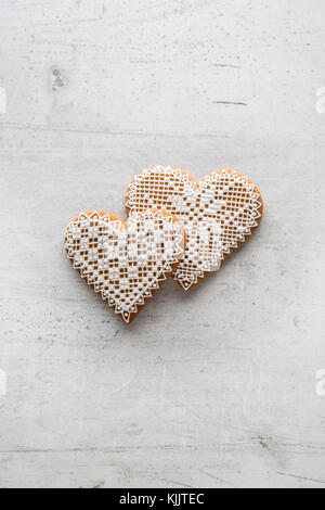 Frame made of sweet heart shaped cookies, sprinkles and gifts on red ...