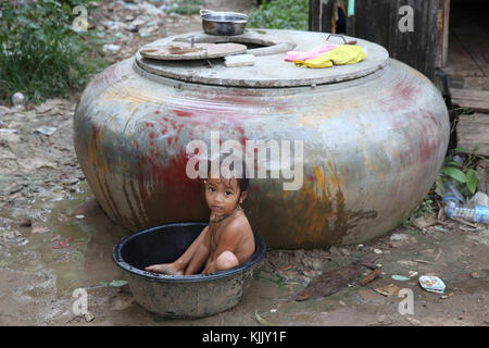 Girl bathing in a slum. Battambang. Cambodia Stock Photo - Alamy