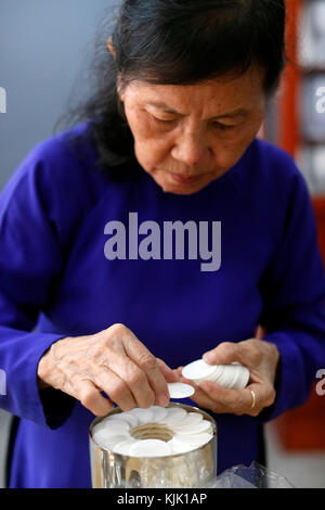 Woman with Roman Catholic unleavened wafers for the Holy Communion. Our ...
