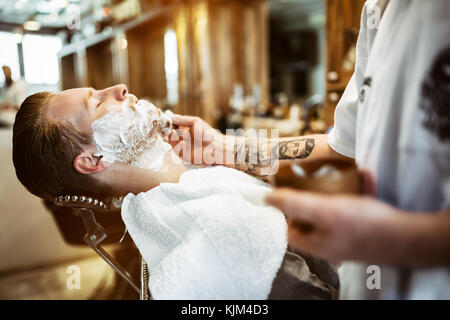 Retro shaving with foam in barber shop Stock Photo - Alamy