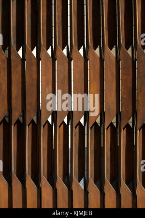 Cor-ten steel entrance gate with passing figure. Rathbone Square ...